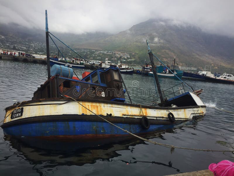Old sinking boat in Harbor editorial stock photo. Image of town - 170273243