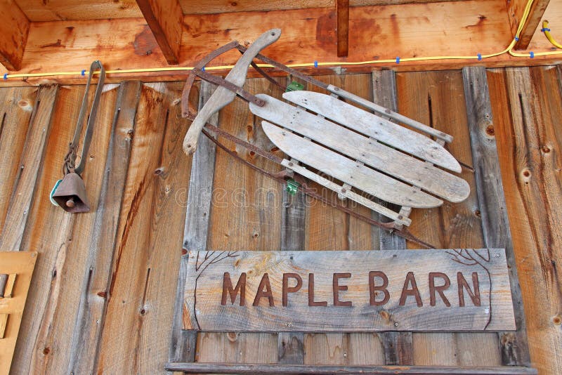 Old Sled on Wall As Decoration with Maple Barn Sign Stock Image - Image ...
