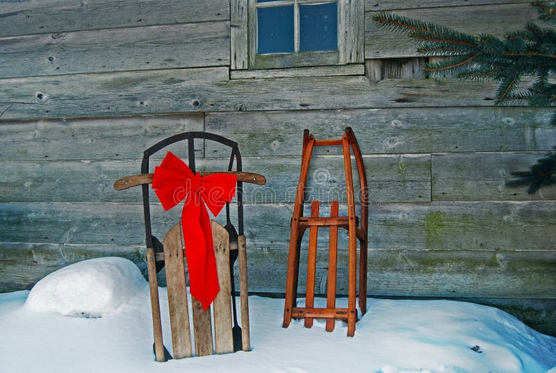 Old sleds with red bow stock photo. Image of holiday, snow - 8063438