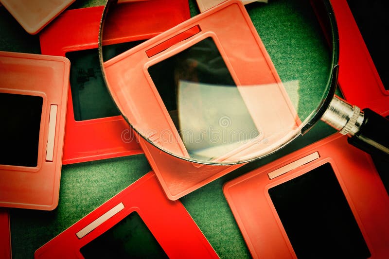Old Slides and a Magnifying Glass Stock Photo - Image of projection ...