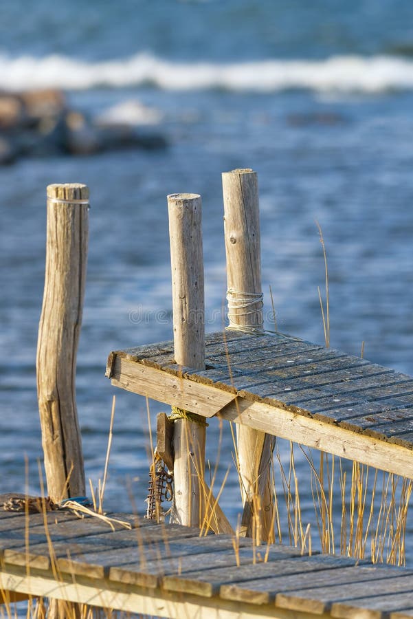 Old Small Jetty at Swedish Coastline during Afternoon Sun Stock Photo ...