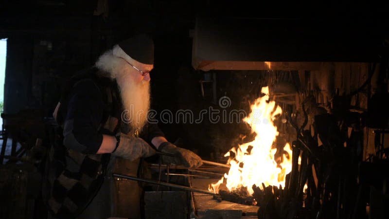 An Old Smith is Working in a Smith Stock Footage - Video of metalwork ...