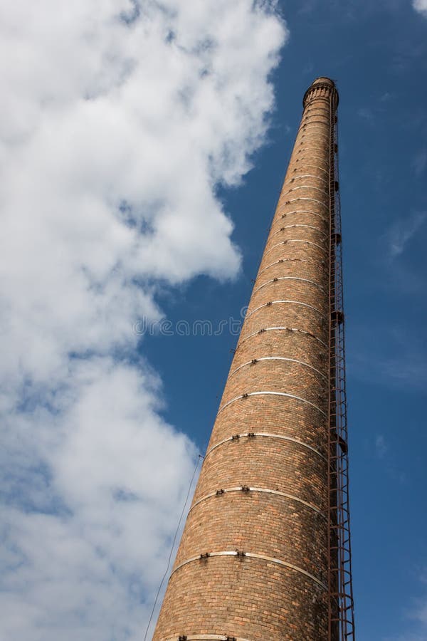 Old Smokestack Against Blue Sky Stock Photo - Image of smokestack ...