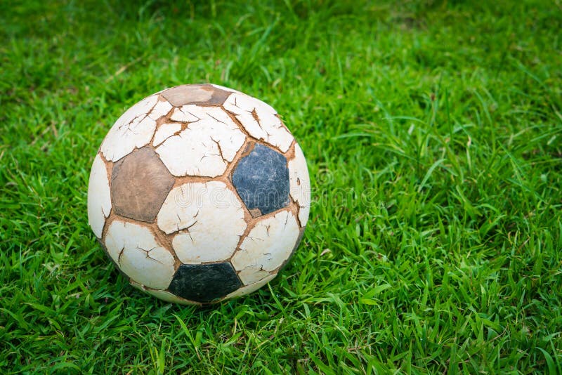 .Old Soccer Ball on Fresh Spring Green Grass Stock Image - Image of ...