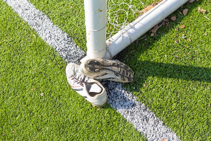 Old Soccer Shoes on Artificial Turf Field Stock Photo - Image of ...