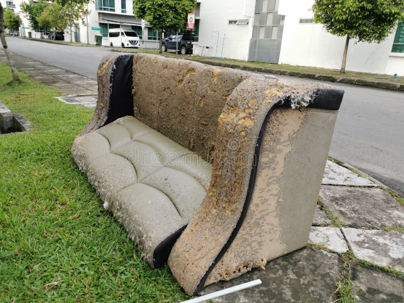 Old Sofa at Apartment Garbage Collection Area by the Road Side. Stock ...