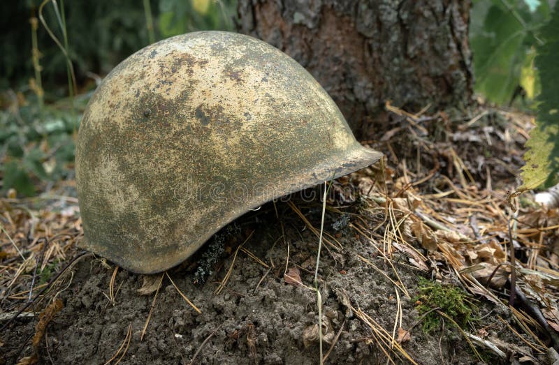An Old Soldier S Helmet on the Ground. a Rusty Helmet from the War in ...