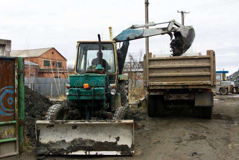 An Old Soviet Tractor Digs and Loads Waste Stone Processing Stock Image ...