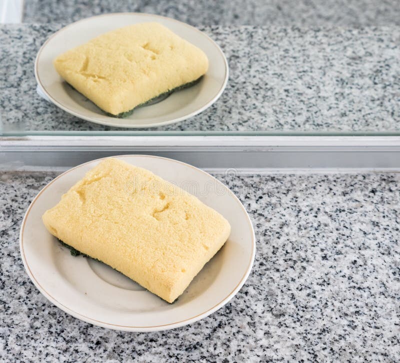 Old Sponge on the White Dish. Stock Image - Image of shape, mirror ...