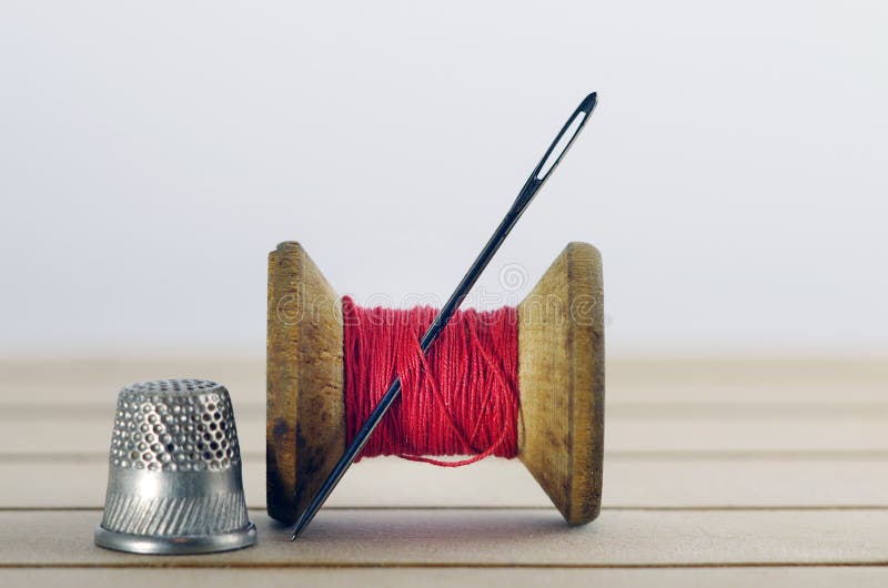 Old Spool of Thread with Needle Closeup Stock Photo - Image of formal ...