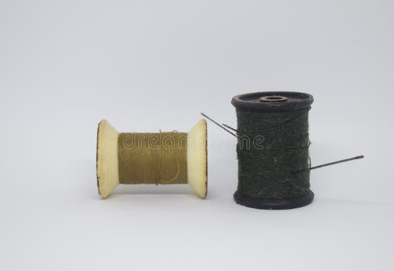 Old Spool of Thread with Needle Isolated on White Stock Image - Image ...