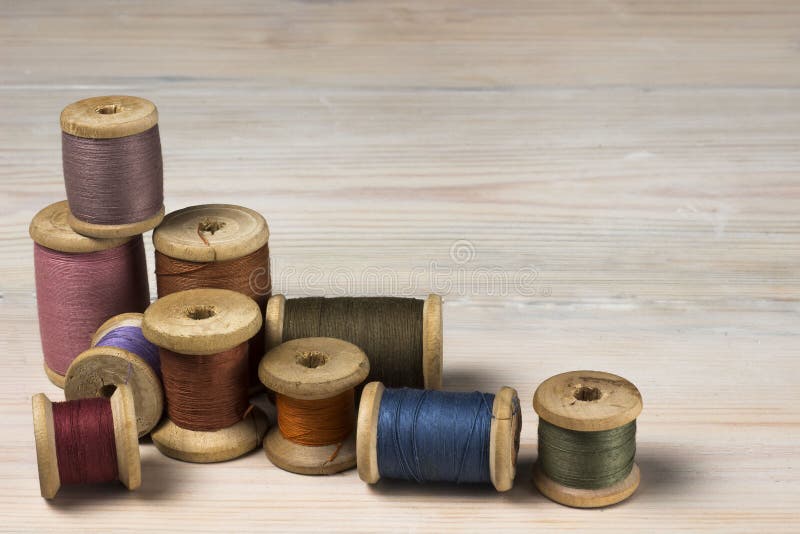 Old Spools of Thread on Wooden Background Stock Photo - Image of ...