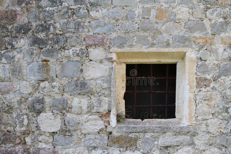 Old Square Window with Bars in a Stone Wall Stock Image - Image of ...