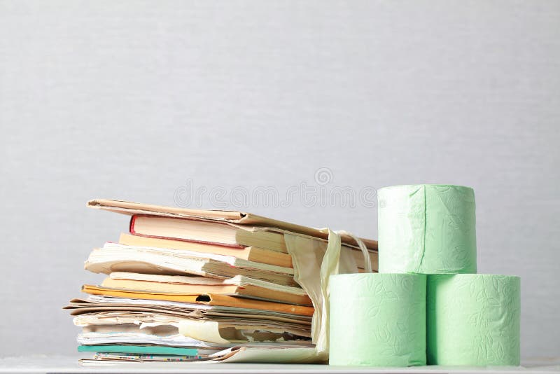 Old Stack of Waste Paper and a Roll of Toilet Paper Stock Photo - Image ...