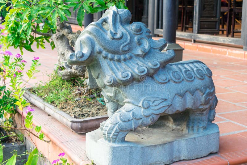 Old Statue of Stone with Flowers in Asia Stock Photo - Image of flower ...