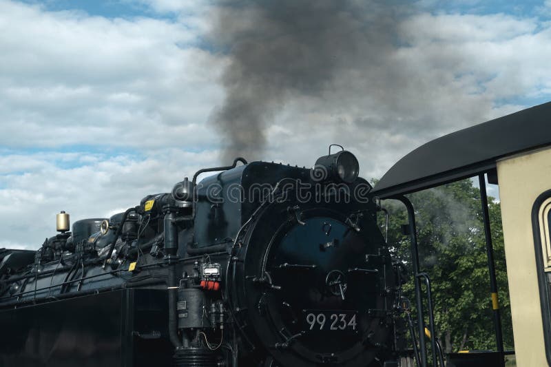An Old Steam Locomotive Leaves the Depot for a Tourist Route Editorial ...