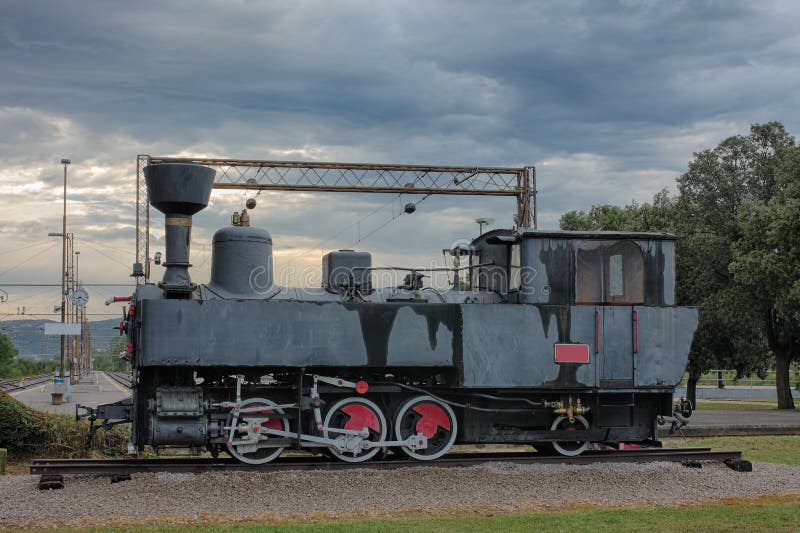 Old Steam Locomotive at Train Station on Cloudy Day Stock Photo - Image ...