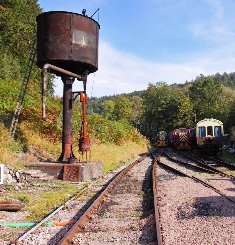 Old Steam Railroad Tracks and Rusting Water Tower Stock Image - Image ...