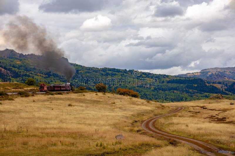 Old Steam Train on an Old Dirty Road Passing through Fields Stock Photo ...