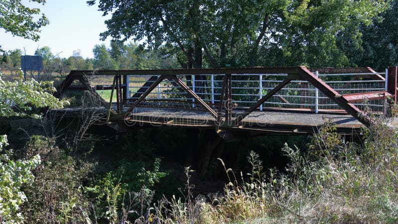 Old Steel Bridge Over a Creek Stock Photo - Image of direction, nature ...