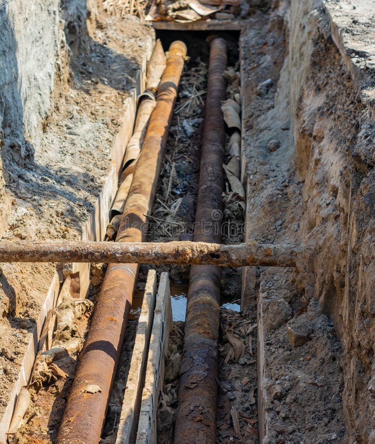 Old Steel Pipe in Pit on Day Stock Photo - Image of industrial ...