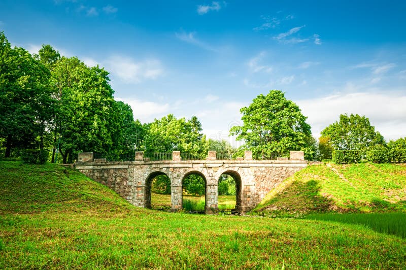 Old stone bridge in park stock photo. Image of landmark - 62539688