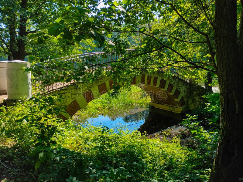 Old Stone Bridge in Park, Vibrant Green Color Stock Photo - Image of ...