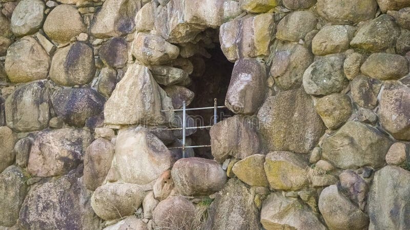 An Old Stone Building with Metal Bars on the Windows. Stock Photo ...