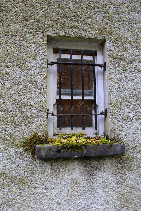 Old Stone Building with Single Window with Heavy Bars Stock Image ...