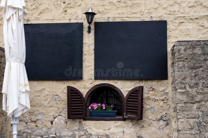 The Old Stone Building with Small Windows with Brown Shutters Stock ...