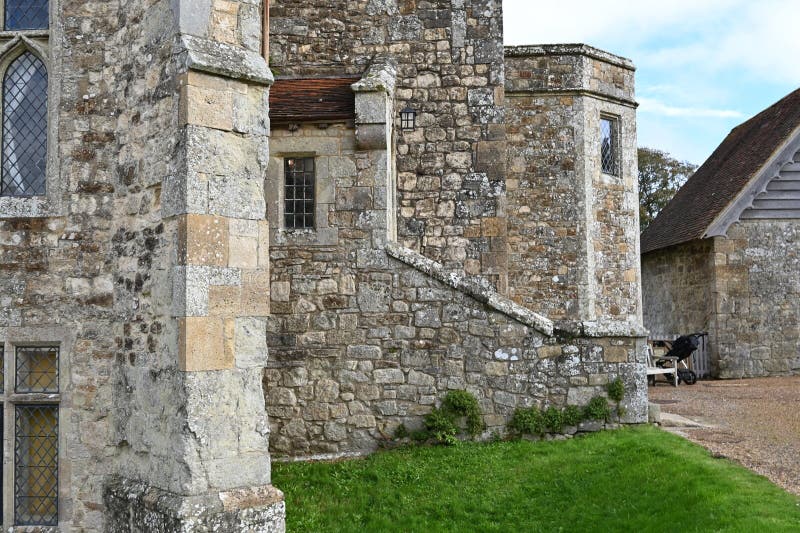 An Old Stone Building Surrounded by Grass and Dirt Path with Steps ...