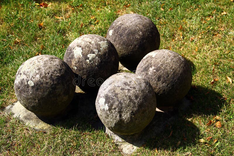 Old Stone Cannon Balls on Grass Stock Photo - Image of weapon, history ...