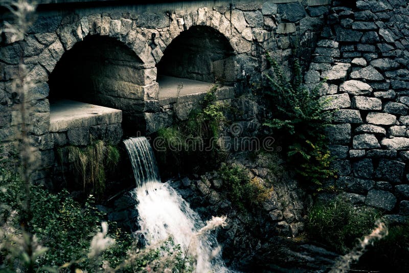 Old Stone Dam with Arch Holes Stock Image - Image of holes ...