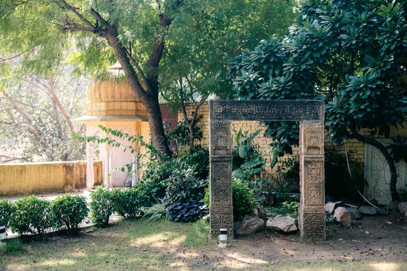 Old stone gate in garden stock photo. Image of door - 261111112