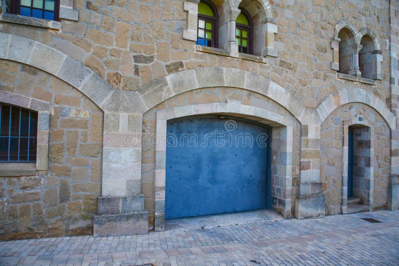 Old Stone Gothic Building with a Garage for a Car Stock Photo - Image ...