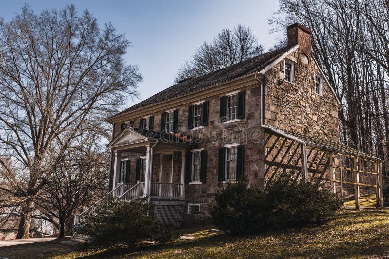 Old Stone House, Nestled on a Grassy Hillside, Surrounded by a Canopy ...