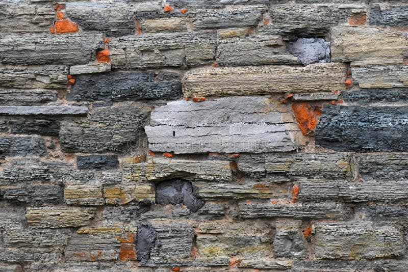 Old stone layered wall stock image. Image of material - 63117081