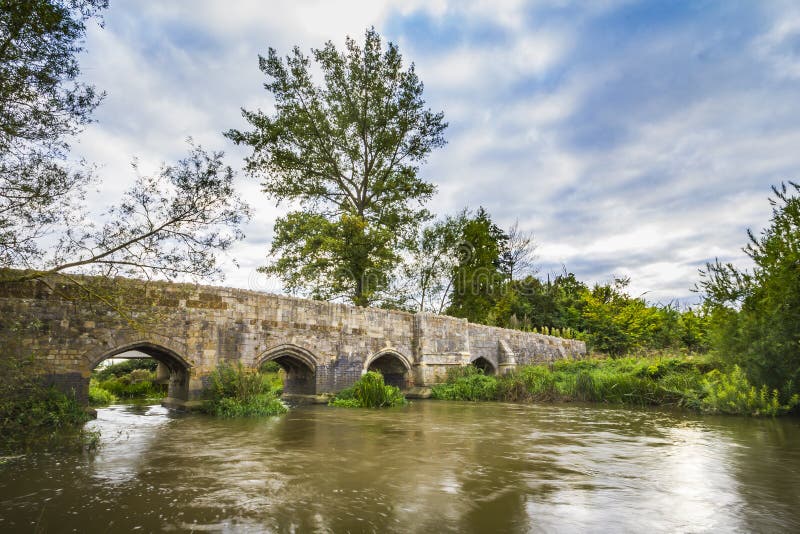 Old Stone Medival Bridge Over a Streaming River Stock Photo - Image of ...