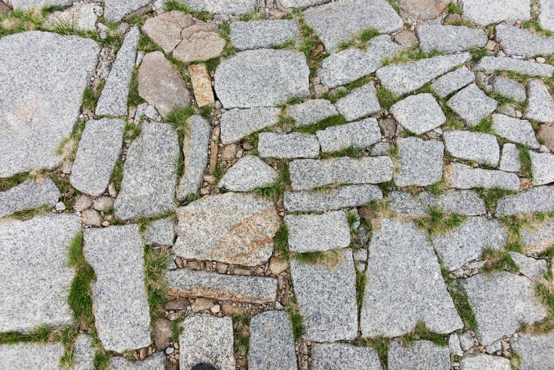 Old Stone Pavement Texture with Grass. Granite Cobblestones Pavement ... Old Stone Pavement Texture with Grass. Granite Cobblestones Pavement ...