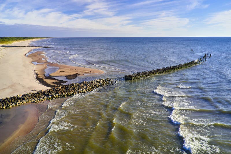An Old Stone Ruined Pier at Low Tide. a Landscape with a Pleasant Shore ...