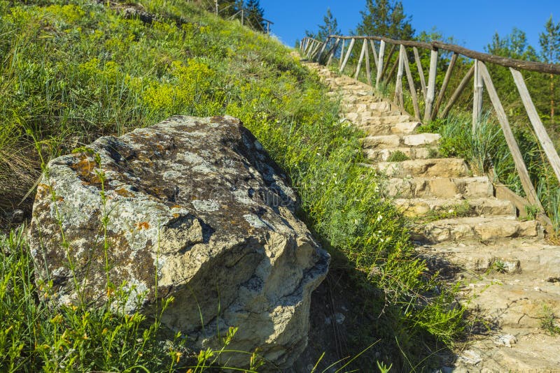 Old stone stairs on a hill stock photo. Image of staircase - 255890778