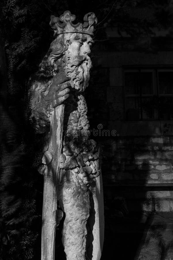 Old Stone Statue with Crown and Sword Stock Photo - Image of sculptor ...