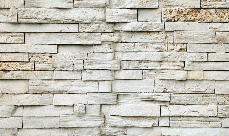 Old Stone Wall Cladding Made of Horizontal White Bricks with Brown ...