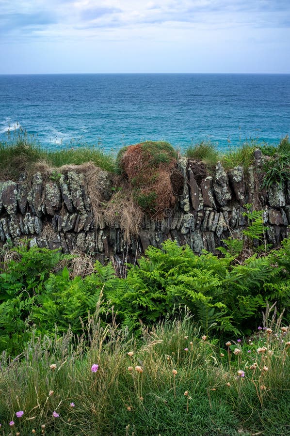 Old Stone Wall Overlooking the Ocean Stock Image - Image of rugged ...