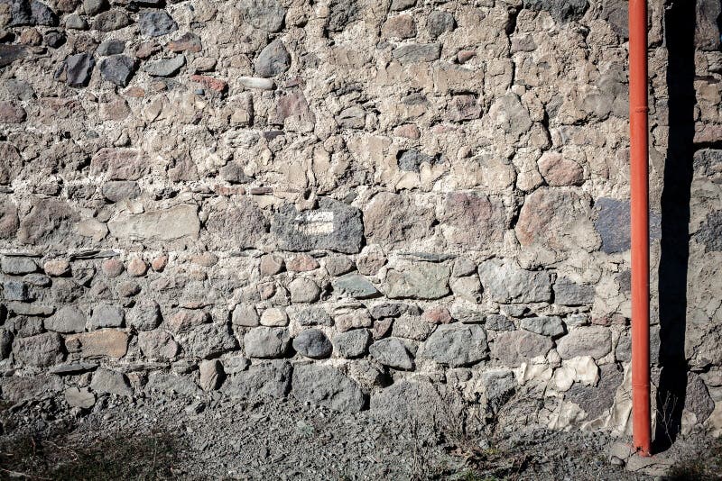 Old stone wall and pipe stock image. Image of detail - 53221999