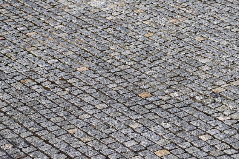 An Old Stoneblock Pavement Cobbled with Granite Blocks. Photo in ...
