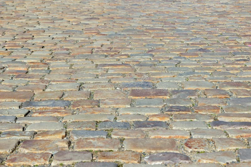 An Old Stoneblock Pavement Cobbled with Square Granite Blocks Stock ...