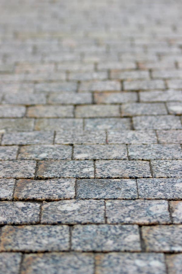 Old Stoneblock Pavement Cobbled with Square Granite Blocks with Grass ...