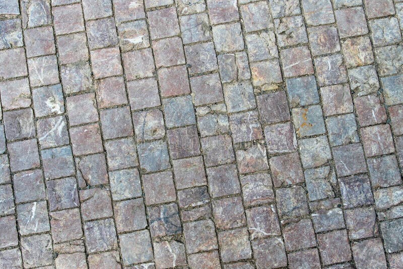 An Old Stoneblock Pavement Cobbled with Square Stone Blocks Stock Photo ...