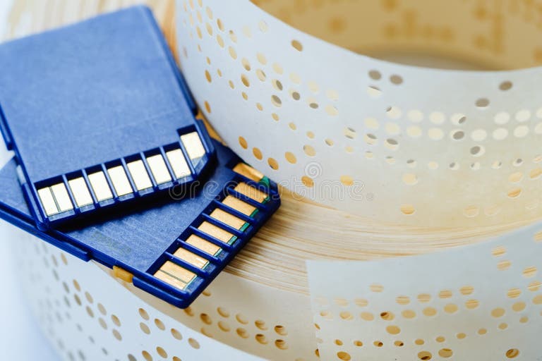 Old Storage Paper Obsolete Punched Tape and Sd Card, Flash Stock Image ...